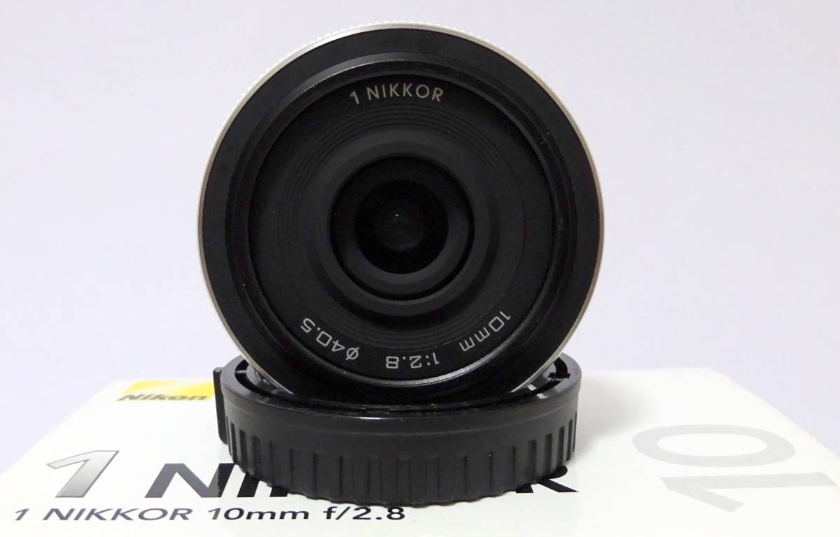 Nikon ニコン 単焦点レンズ 1 NIKKOR 10mm f/2.8 ホワイト フィルターのオマケつき(ニコン)｜売買されたオークション ...