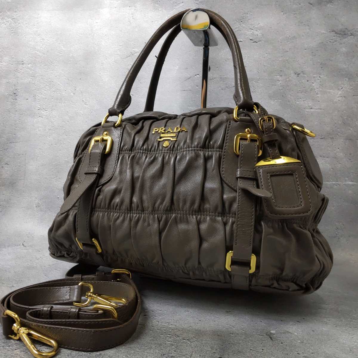 1円 PRADA プラダ オール レザー ギャザー 2way ハンドバッグ ショルダー 金具 チャーム ゴールド ブラウン 白タグ 332(ショルダーバッグ)｜売買されたオークション情報 ...
